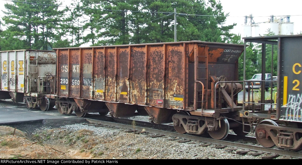CSXT 290560 X-SBD nee-SCL 3-bay aggregate hopper being shoved east through the Cartersville ...